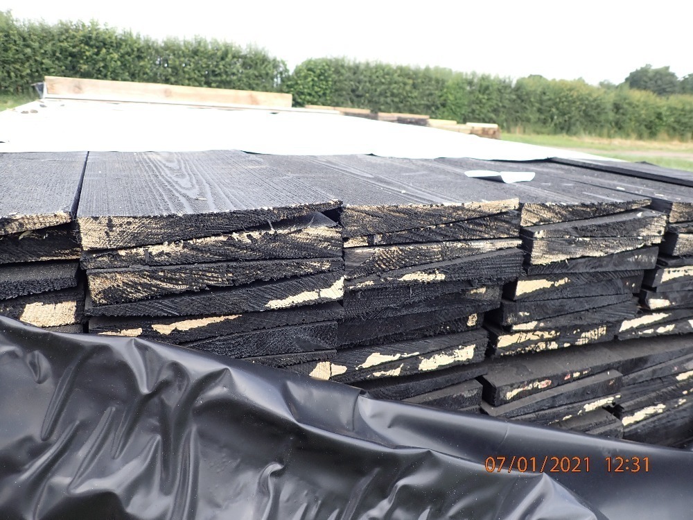 Pack of timber boards, spars, hardwood, joists, kerruing, trailer ...